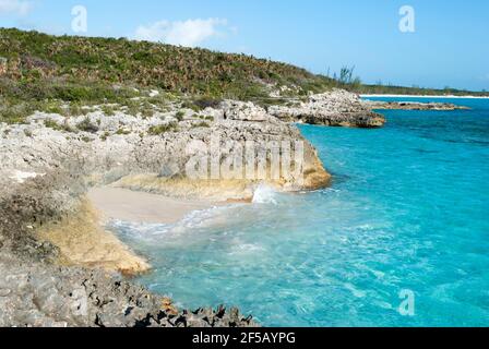 The scenic view of Half Moon Cay rocky shore and turquoise color waters ...