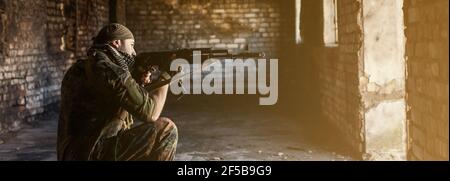 Arab soldier aiming with Kalashnikov AK-47 assault rifle Stock Photo ...