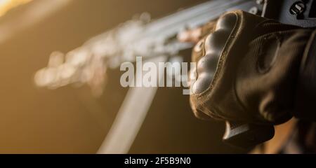 Hand holding Kalashnikov assault rifle first person view Stock Photo ...