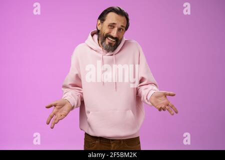 Portrait doubtful unsure awkward mature man shrugging spread hands ...