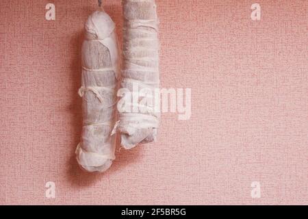 Pork loin, polendwitz wrapped in gauze and hung for drying Stock Photo ...