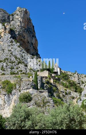 Moustiers-Sainte-Marie famous village at the bottom of a cliff, in ...