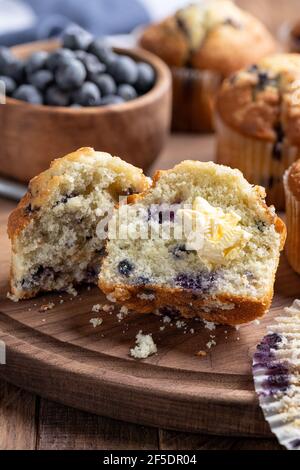 Muffin sliced in half on a plate with a cup of tea and pumpkins Stock ...