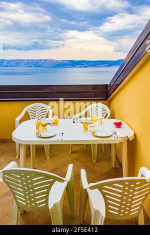 Prepare food for breakfast on balcony with view of Novi Vinodolski in ...