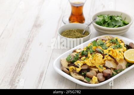 bagila bil dihin, iraqi breakfast; boiled dried broad beans and ...