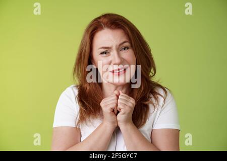 Silly touched tender redhead charmed middle-aged woman sighing gladly ...
