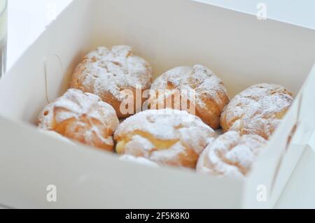 choux cream or cream puff, eclair in the wooden dish Stock Photo - Alamy
