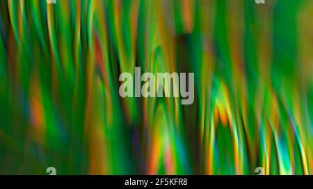 Abstract blurry green background with rainbow glow Stock Photo - Alamy