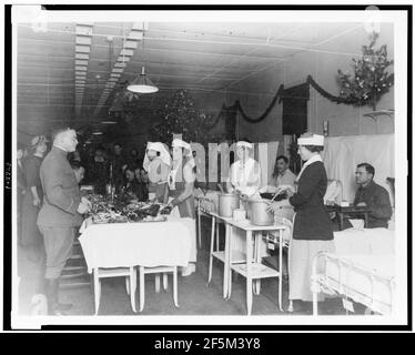 Red Cross nurses serving food to soldiers in hospital, during Christmas ...