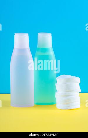 Blue skin care toner bottle on pink geometrical background Stock Photo ...