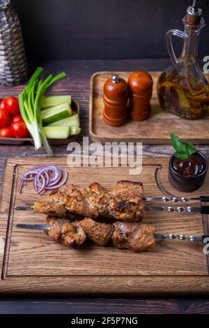Shish kebab with onions and tomatoes close-up. High quality photo Stock ...