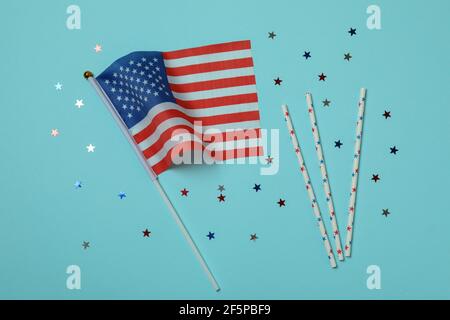 American flag, glitter and straws on blue background Stock Photo - Alamy