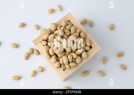 parched soy beans in measuring box isolated on white background Stock ...