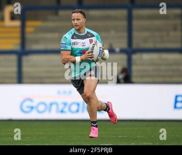 Korbin Sims (10) of Hull KR looks to go past Matty Gee (18) of Leigh ...