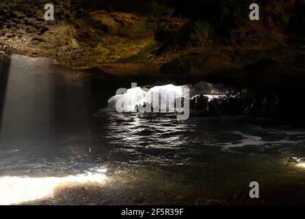 Spectacular Mermaid Caves with sunlight piercing through hole in ...