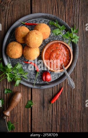 Arancini. Italian Rice Balls with Mozzarella and Sun-dried tomatoes ...