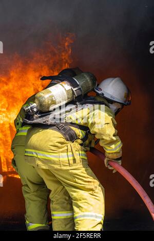 Mine Emergency Response Team in protective clothing and breathing ...