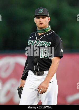 Stetson infielder Kyle Ball (13) throws during an NCAA baseball game ...