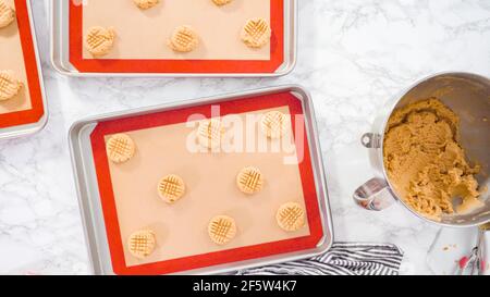 Flat lay. Step by step. Scooping peanut butter cookies dough with dough ...