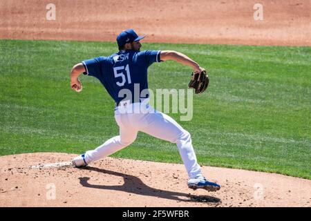 Los Angeles Dodgers pitcher Alex Vesia runs out to take the mound ...