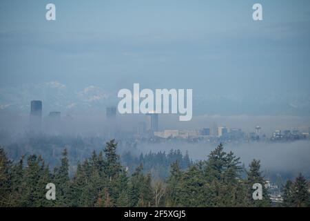 Seattle skyline covered with morning fog on sunny day Stock Photo - Alamy