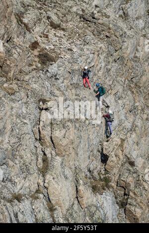 High angle view of female friends holding cigarettes while talking at ...