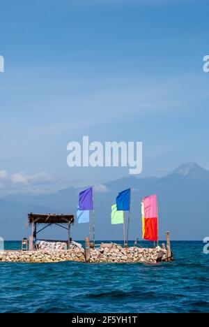 Colorful flags waving against strong winds by the coast Stock Photo - Alamy