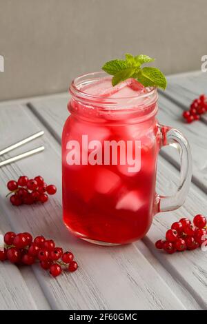 Cold Red Mocktail With Berries on Beach Table, Defocused Sea Waves on ...