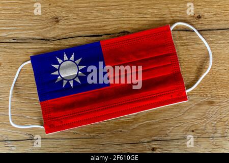 Wooden background with a flag of Taiwan Stock Photo - Alamy