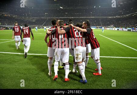 AC Milan football players embracing to celebrate at the San Siro ...