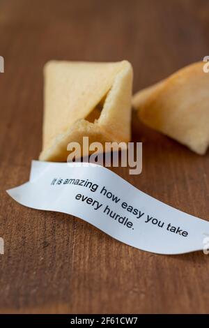 Fortune cookie with blank label, wooden background Stock Photo - Alamy