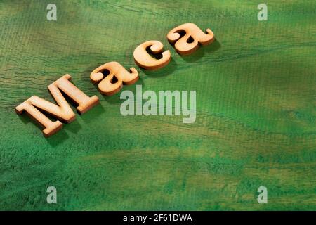 Word maca in wooden letters - Dry Organic Maca Powder. Lepidium meyenii ...