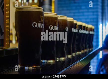 A picture of a row of poured beers at the Guinness Storehouse (Dublin ...