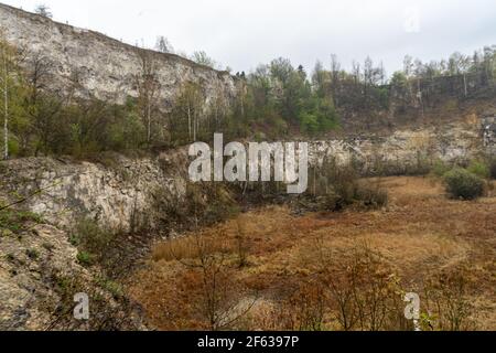 Abandoned Liban Quarry with Jurassic limestone cliffs and old, rusty ...