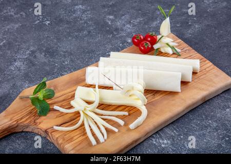 Cecil cheese on wooden background. Angel Hair Cheese, or stringy cheese ...