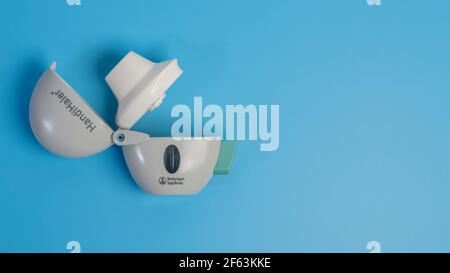 COPD or Asthma medication instruments ,discus inhaler.On blue ...