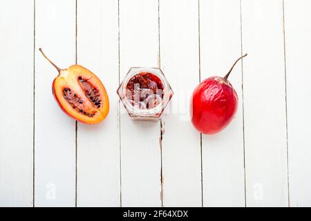 Delicious exotic tamarillo jam in a glass jar Stock Photo - Alamy