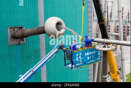 SUZHOU, CHINA - MARCH 4, 2021 - A construction worker checks sulfur ...