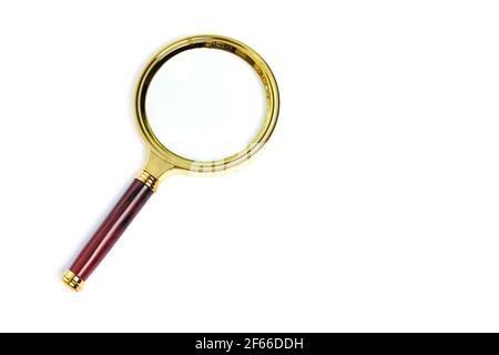 Gold plated magnifier with red handle on white background, isolate ...