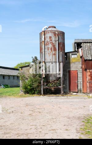 Abandoned, rusty metal silos. Grain storage. Bulk material container ...