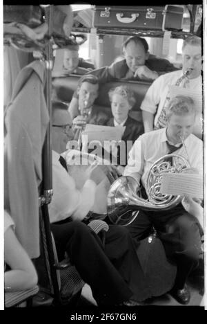 Entertainment on board train home Stock Photo - Alamy