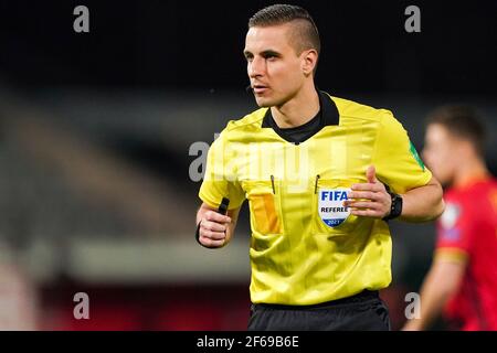 LEUVEN, BELGIUM - MARCH 30: referee Donatas Rumsas and Jeremy Doku of ...
