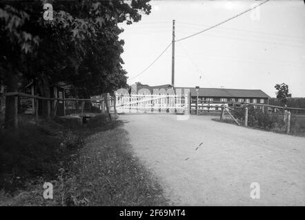 Road transition with gate Stock Photo - Alamy