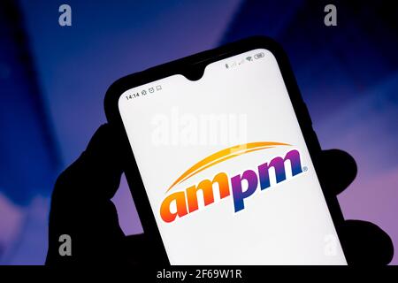 In this photo illustration ampm logo seen displayed on a smartphone Stock Photo - Alamy