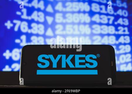 In this photo illustration Sykes Enterprises logo seen displayed on a ...