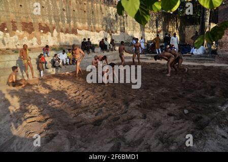 Pakistani Traditional wrestlers or Pehalwans are busy practicing at an ...