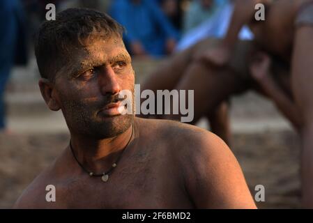 Pakistani Traditional wrestlers or Pehalwans are busy practicing at an ...