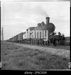 Freight trains pulled of steam locomotive on the line Stock Photo - Alamy