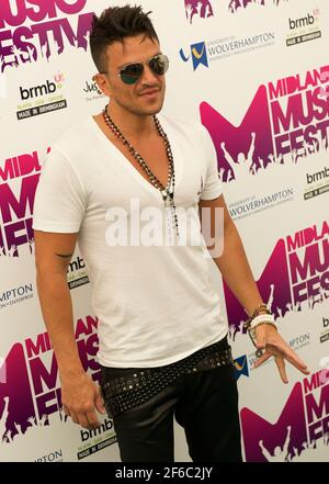 Pop singer Peter Andre poses with a CD of his latest single 'Defender ...