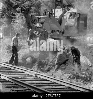 Double track work, excavator Stock Photo - Alamy